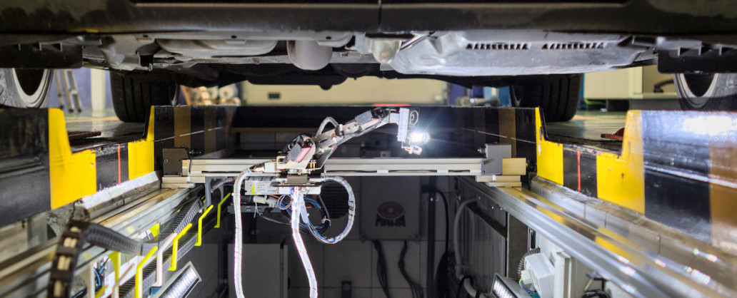 Vehicle technical inspection robotic arm